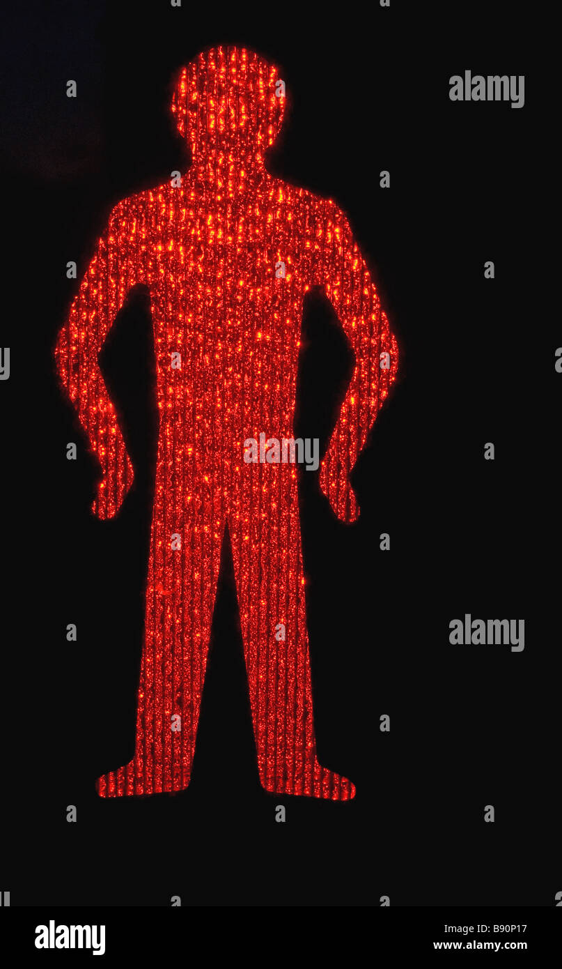 An illuminated DON'T WALK symbol at a pedestrian crossing Stock Photo ...