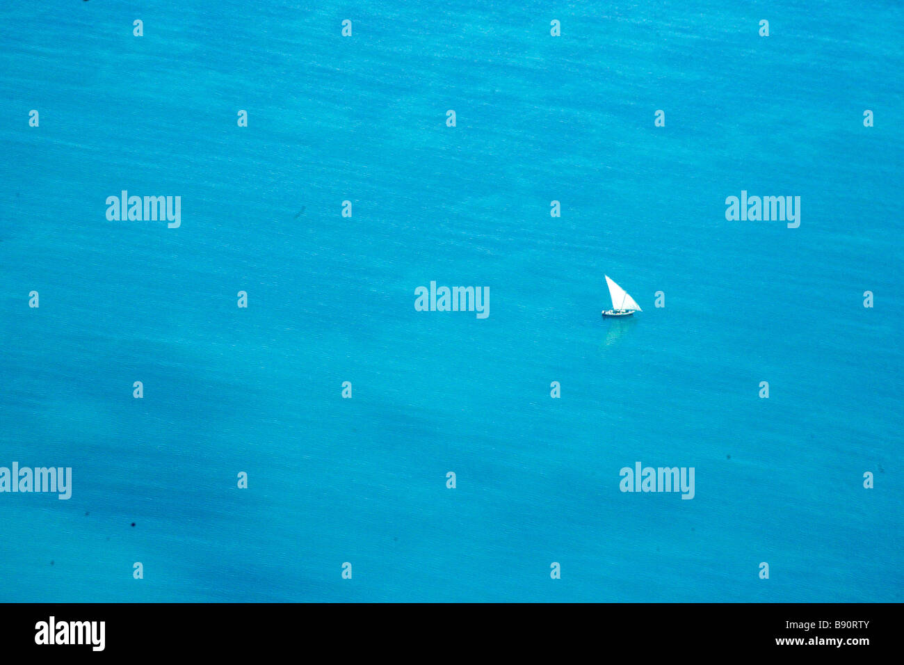azure blue ocean with dhow boat Stock Photo - Alamy