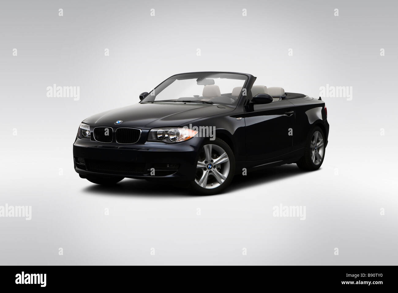 2009 BMW 1-series 128i in Blue - Front angle view Stock Photo - Alamy