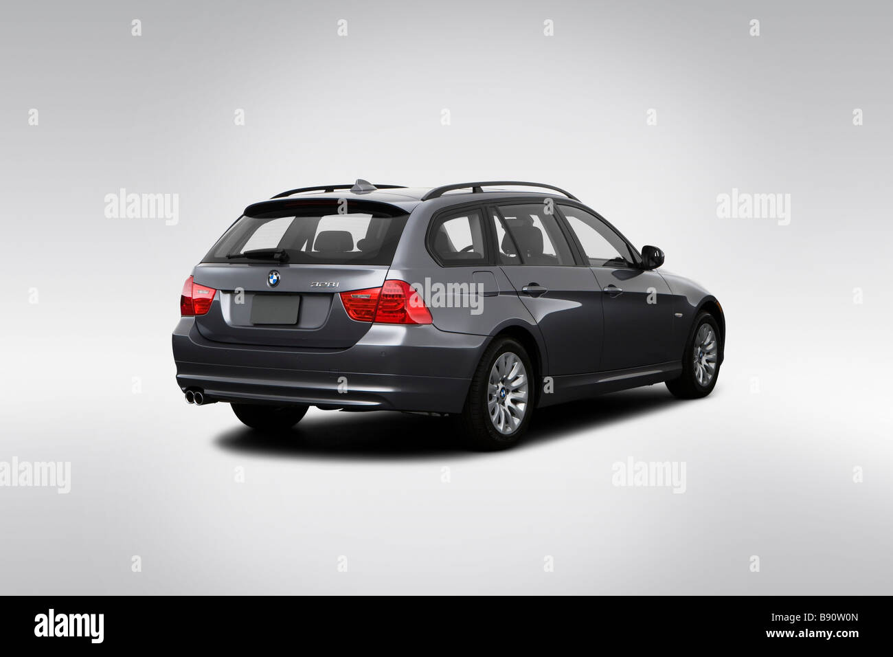 2009 BMW 3-series 328i in Gray - Rear angle view Stock Photo - Alamy