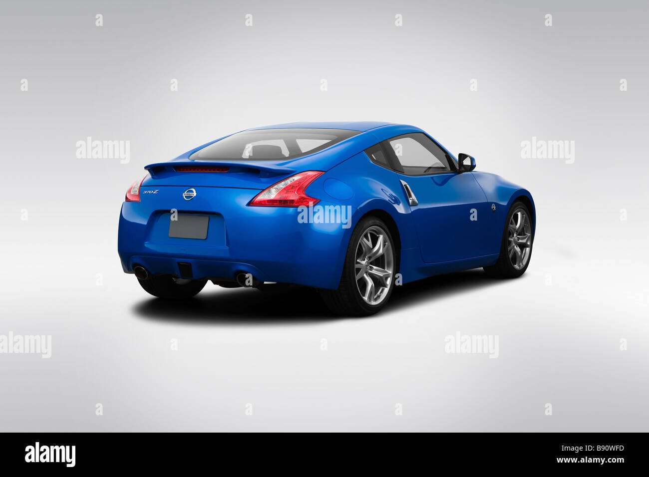 2009 Nissan 370Z SPORT 6MT in Blue - Rear angle view Stock Photo - Alamy