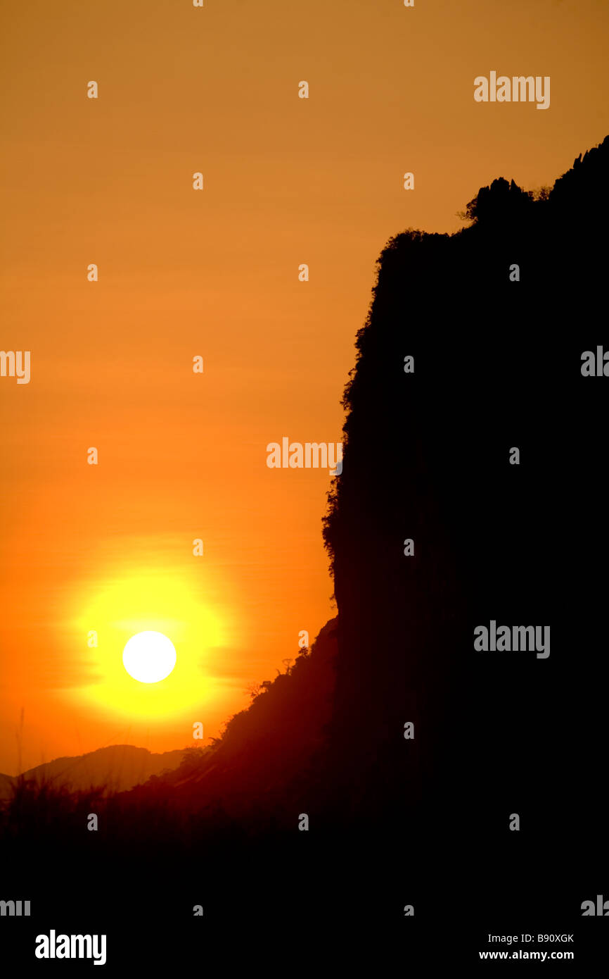 Laos, Vientiane Province, Vang Vieng, limestone hill, sunset Stock ...