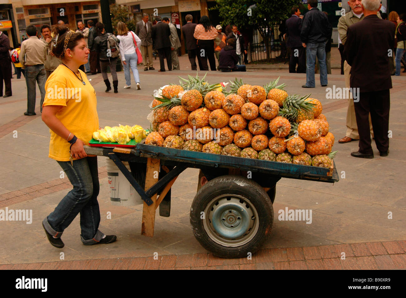 Pine apples fruit exotic woman handcart child labour fresh fruit street ...