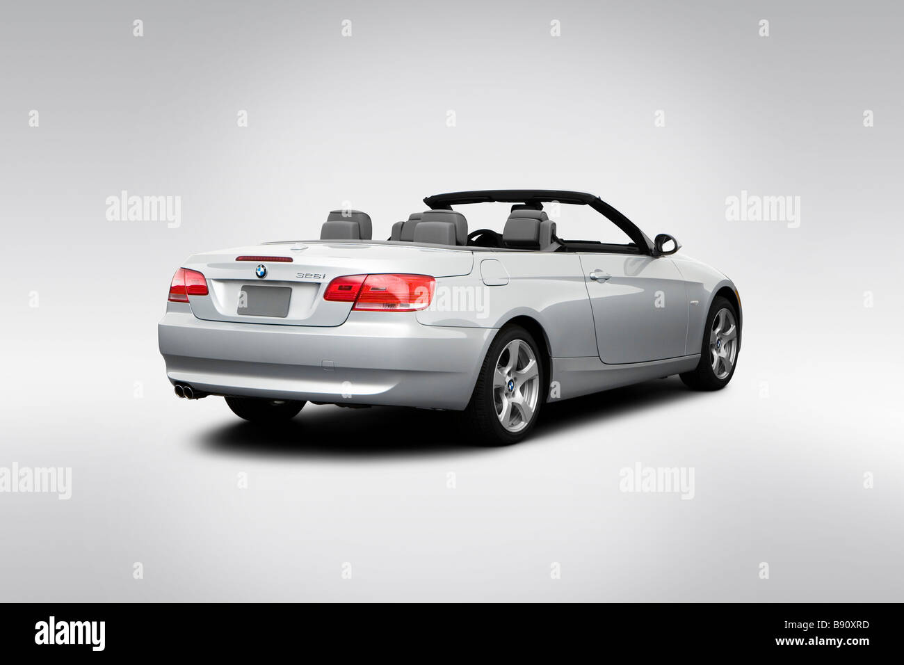 2009 BMW 3-series 328i in Silver - Rear angle view Stock Photo - Alamy