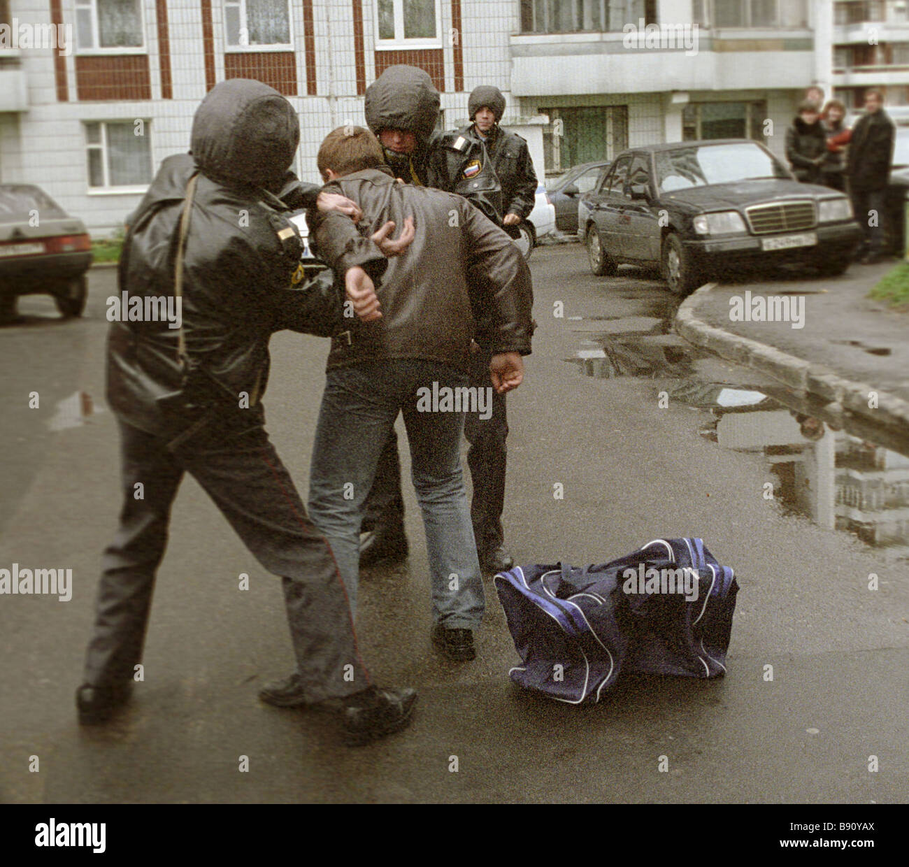 Police officers putting handcuffs on the offender during a training ...