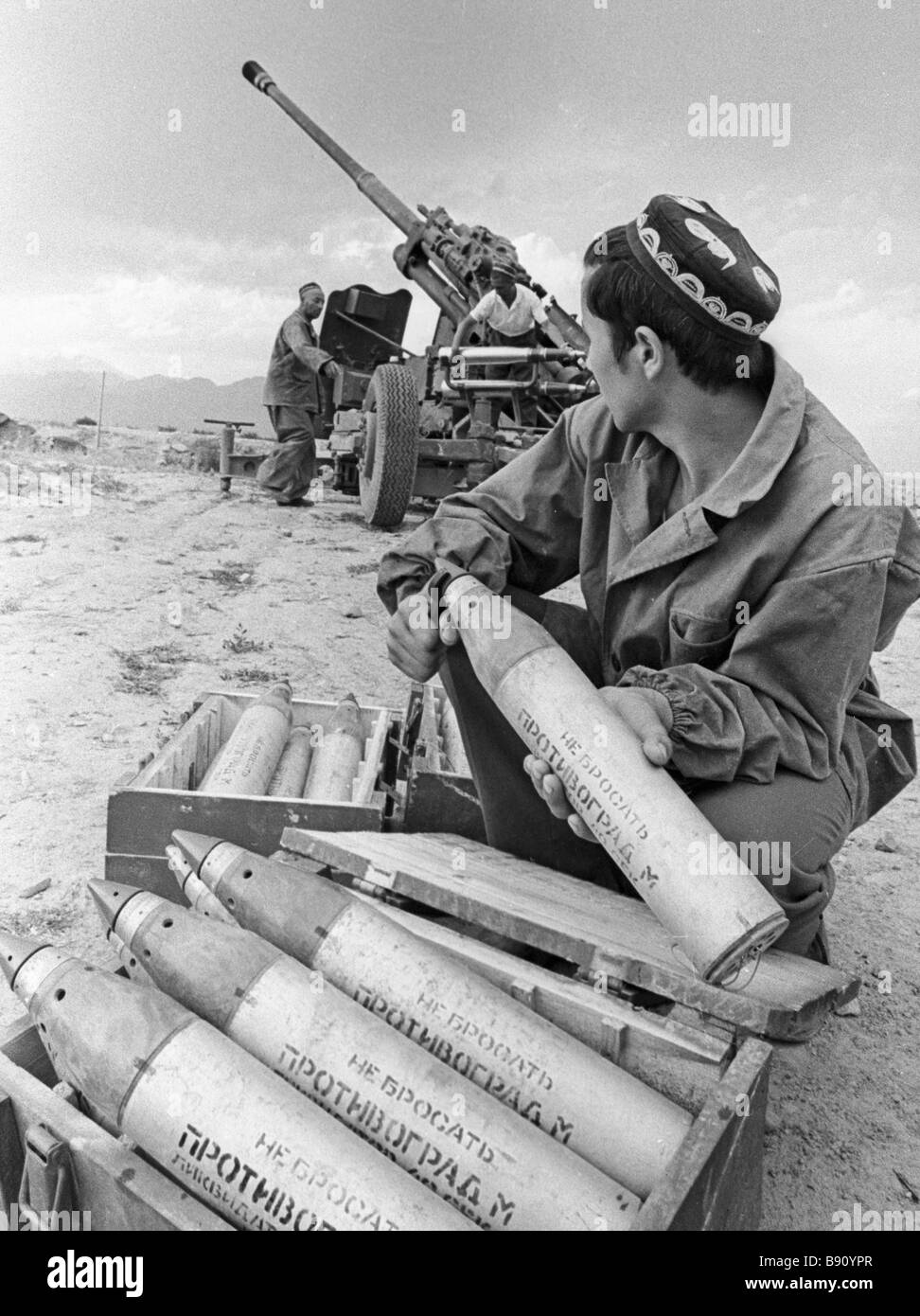 The Uzbek SSR anti hail service loading an anti hail cannon with ...