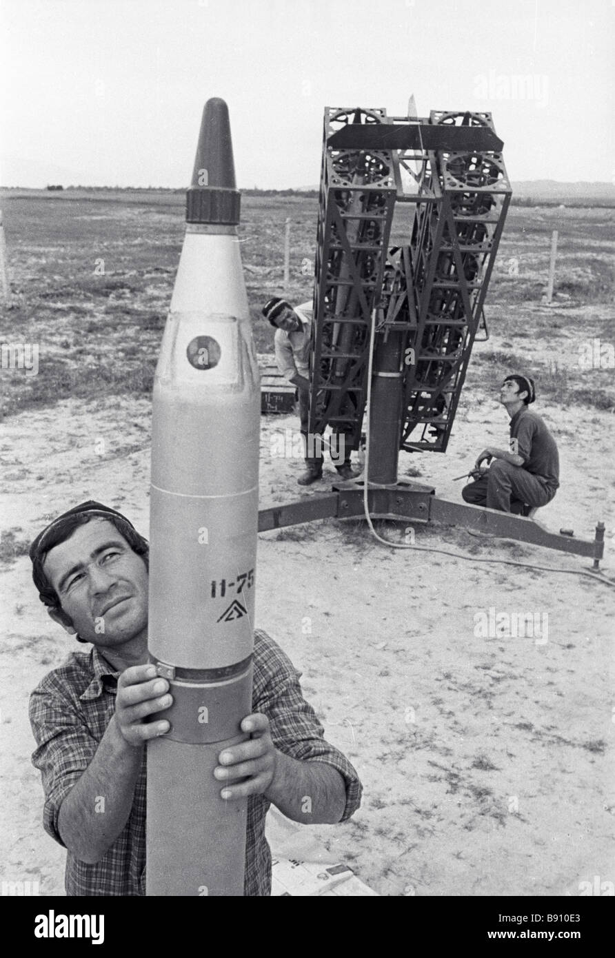 Hail protection technician shows a rocket that protects the cotton ...