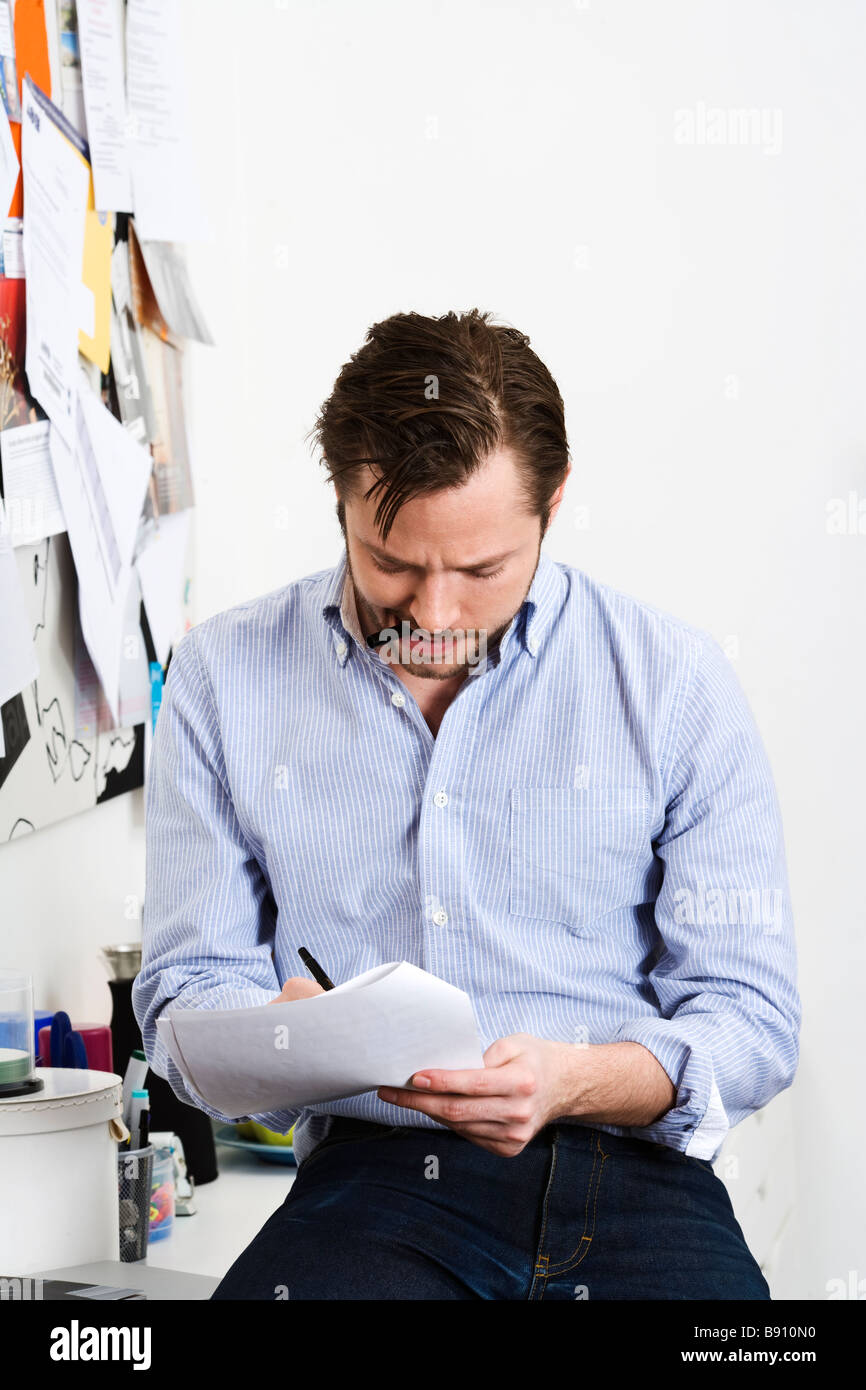 A man reading a document Sweden Stock Photo - Alamy