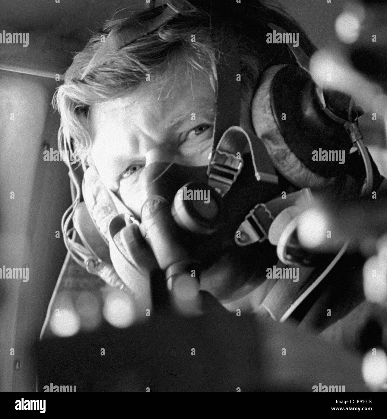 A staff aerologist in the cabin with his equipment for monitoring the ...
