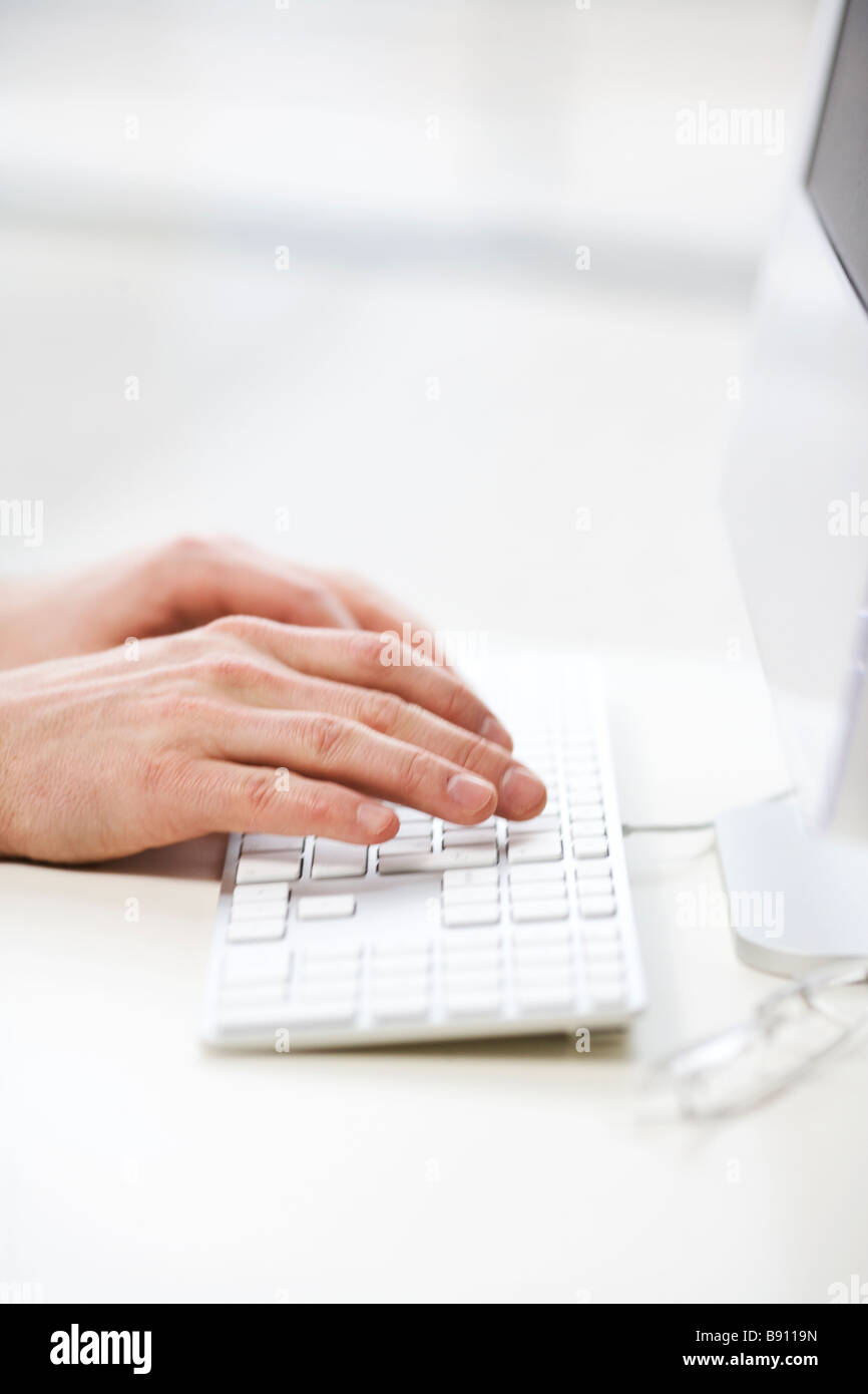 A hand using a keyboard Sweden Stock Photo - Alamy