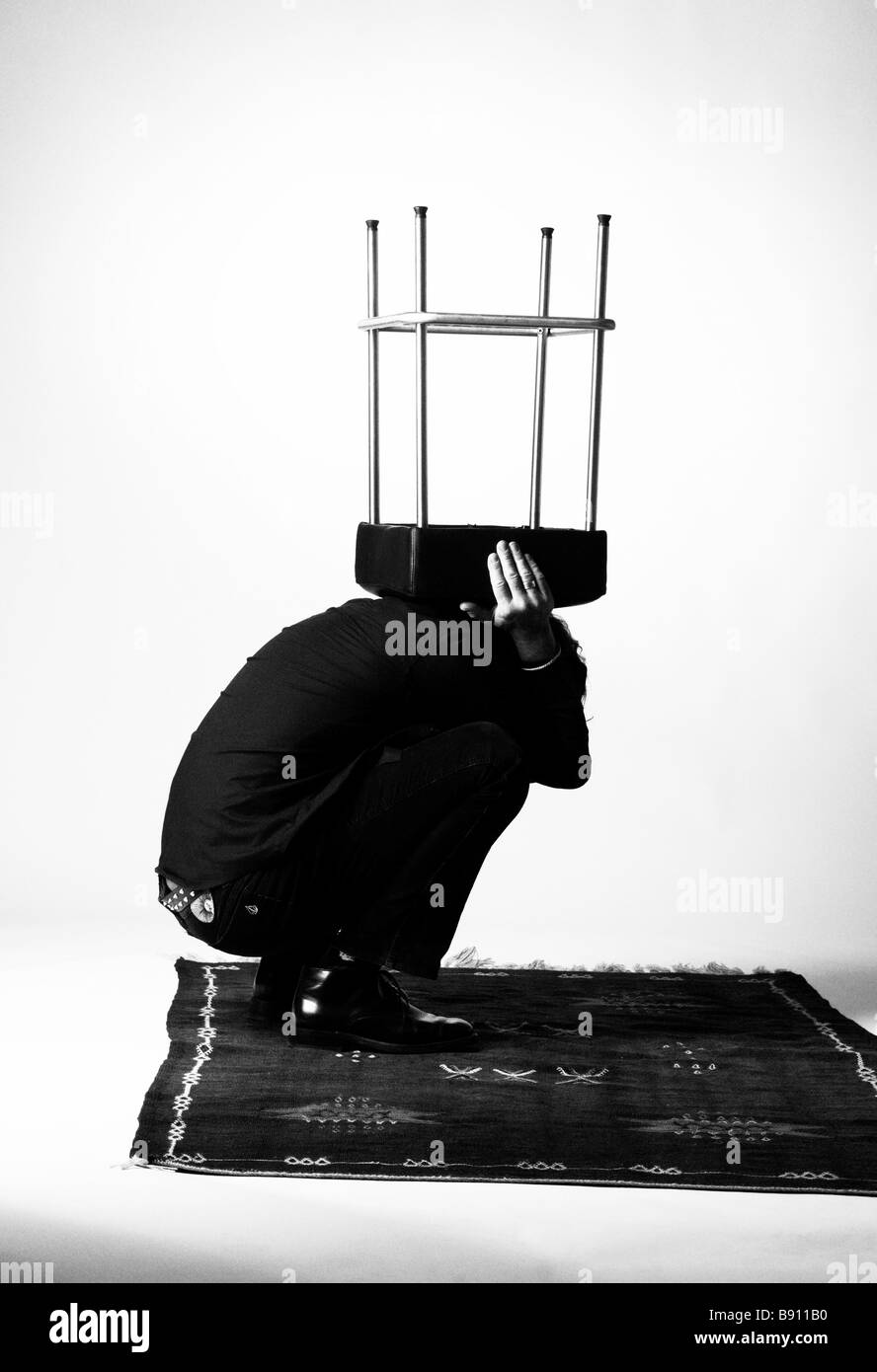 Human footstool hi-res stock photography and images - Alamy