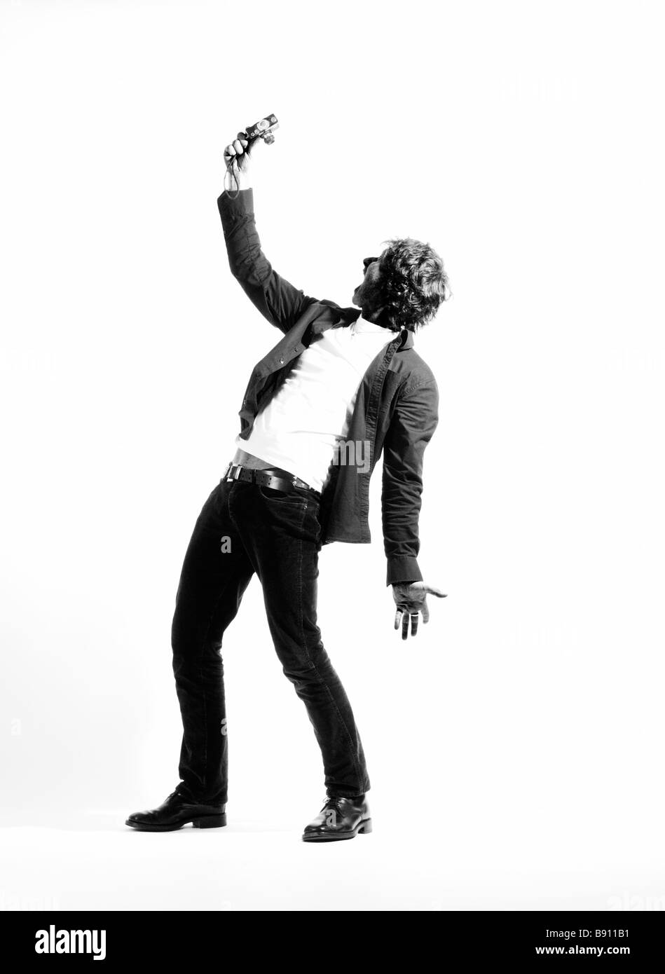 Holding clothes up Black and White Stock Photos & Images - Alamy