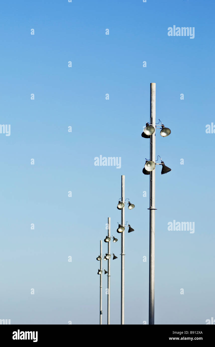 Modern streetlights against a clear blue sky Stock Photo - Alamy