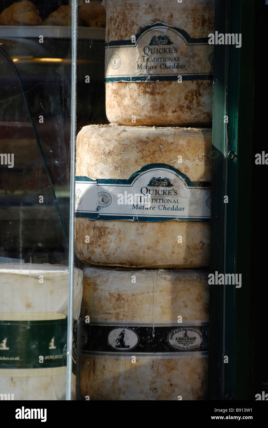Rounds of Chedder Cheeses in window of Deli in Rye in Sussex Stock ...