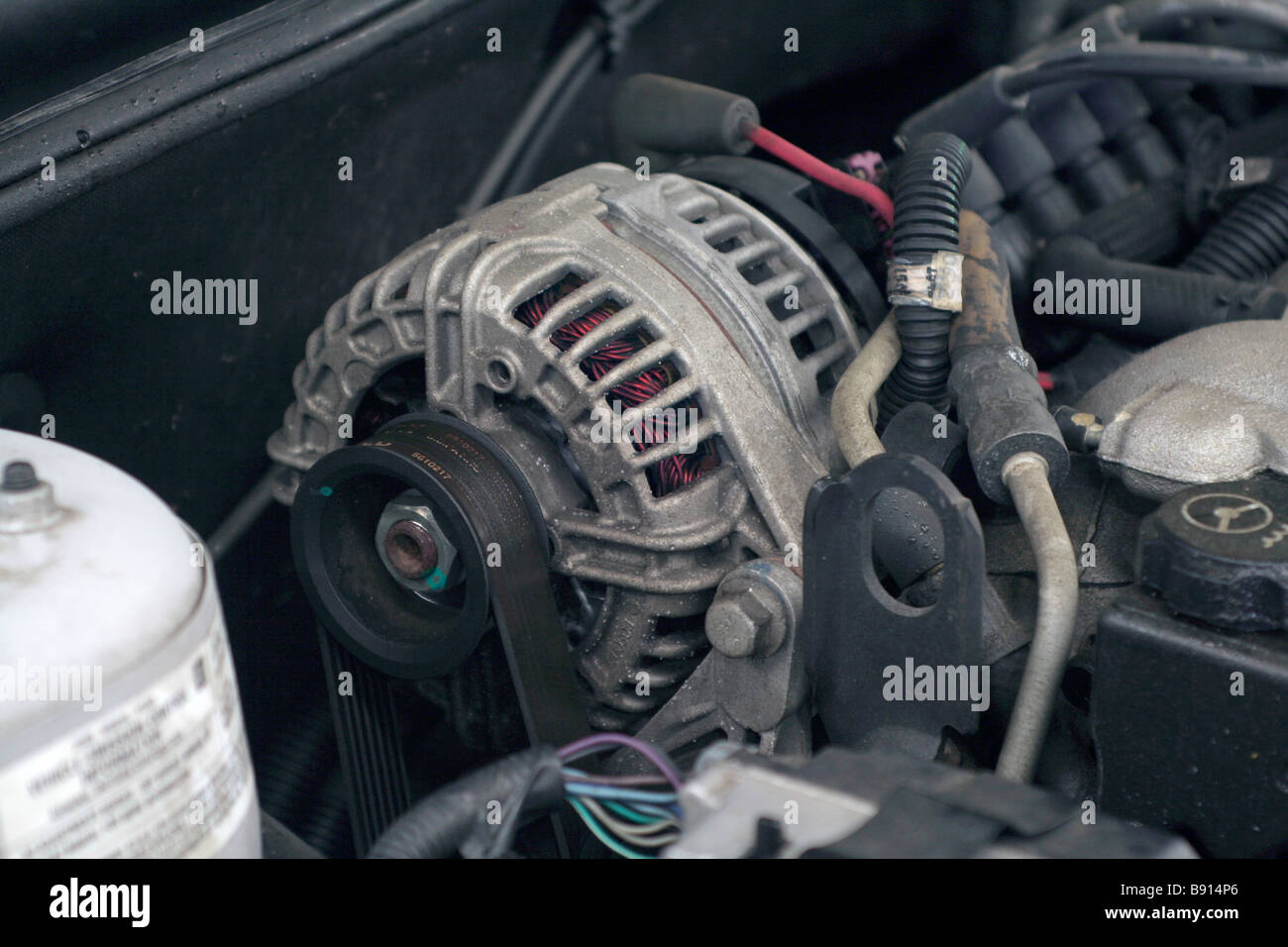 Bosch alternator in service on automobile engine Stock Photo - Alamy