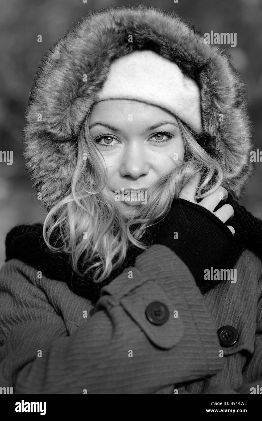 Beautiful Woman keeping herself warm Stock Photo - Alamy