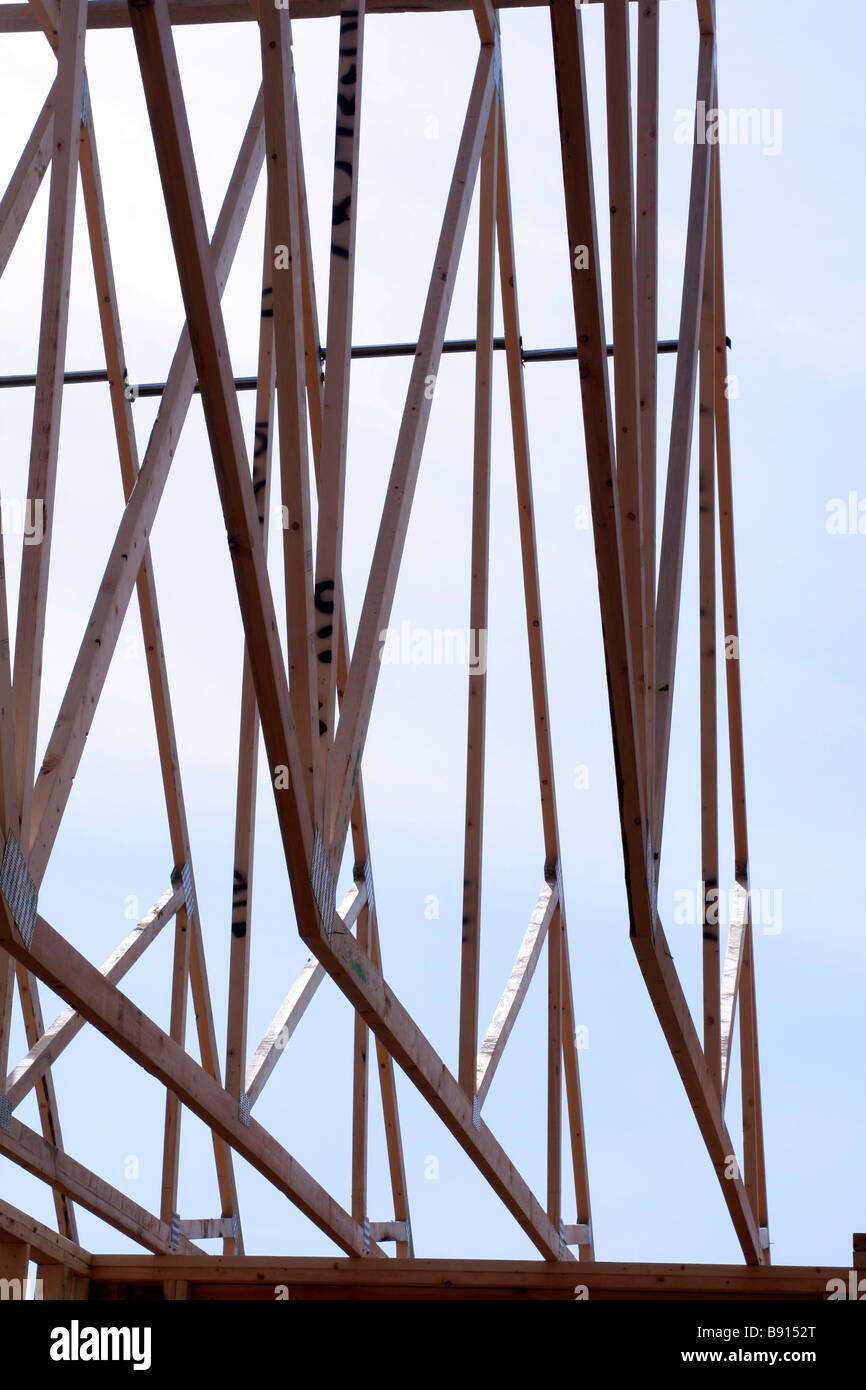 Unusual free hanging truss rafters on new construction Stock Photo - Alamy