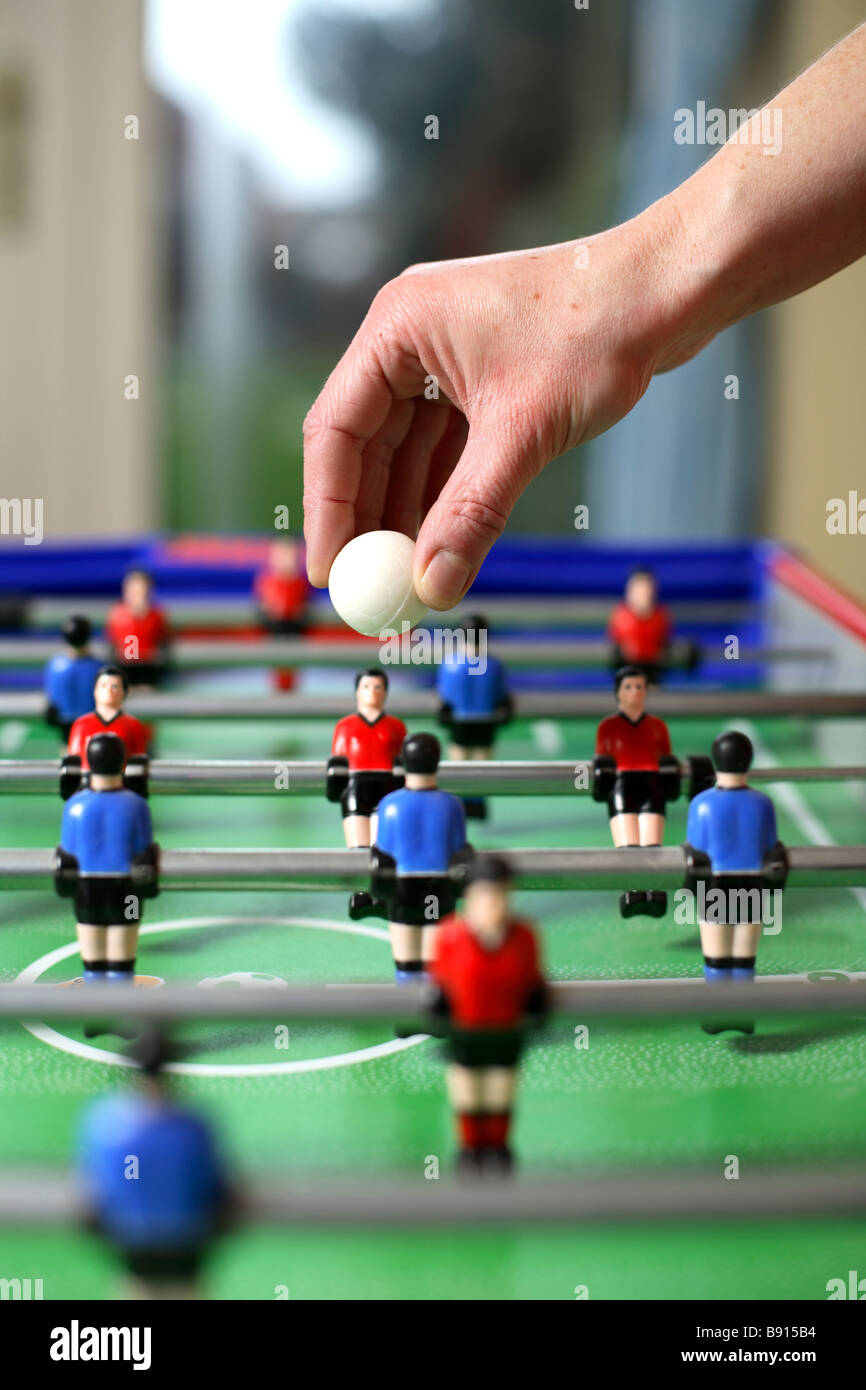 Hand and foosball table hi-res stock photography and images - Alamy