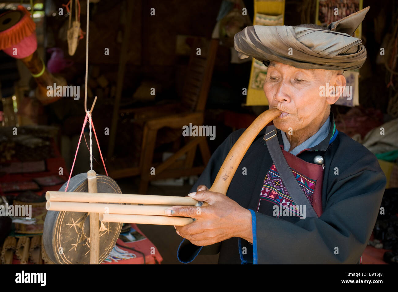 Old man with typical bamboo flute near Chiang Rai Northern Thailand ...