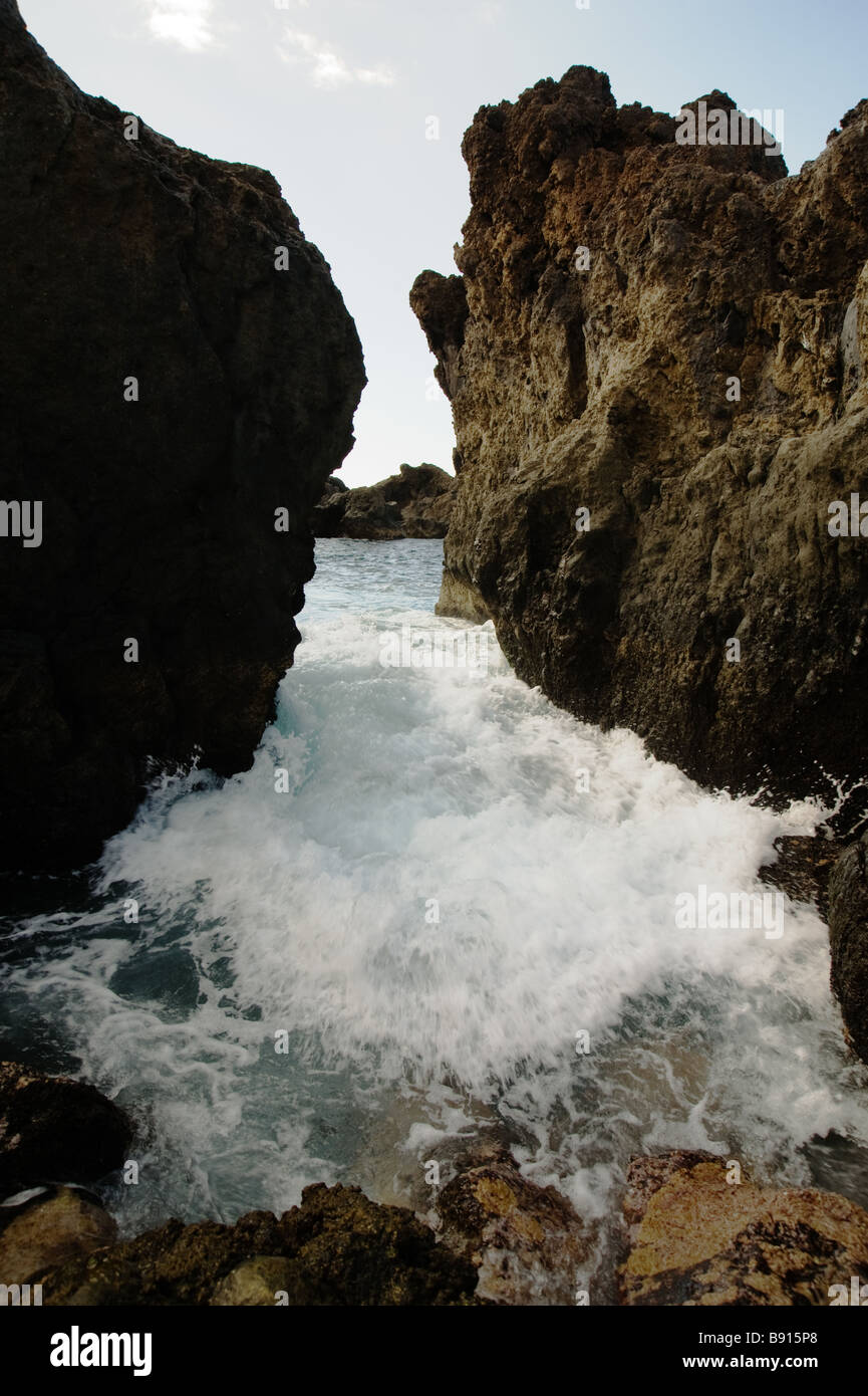 Sea through rocks Stock Photo - Alamy