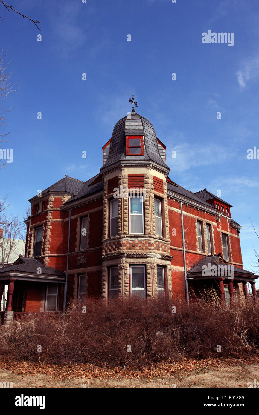 Historic brick house with slate roof and turret on corner, ca. 1890s ...