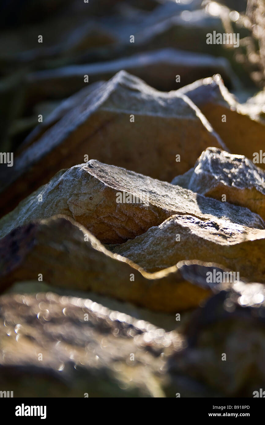 Top of dry frosty stone wall in sunlight Stock Photo - Alamy