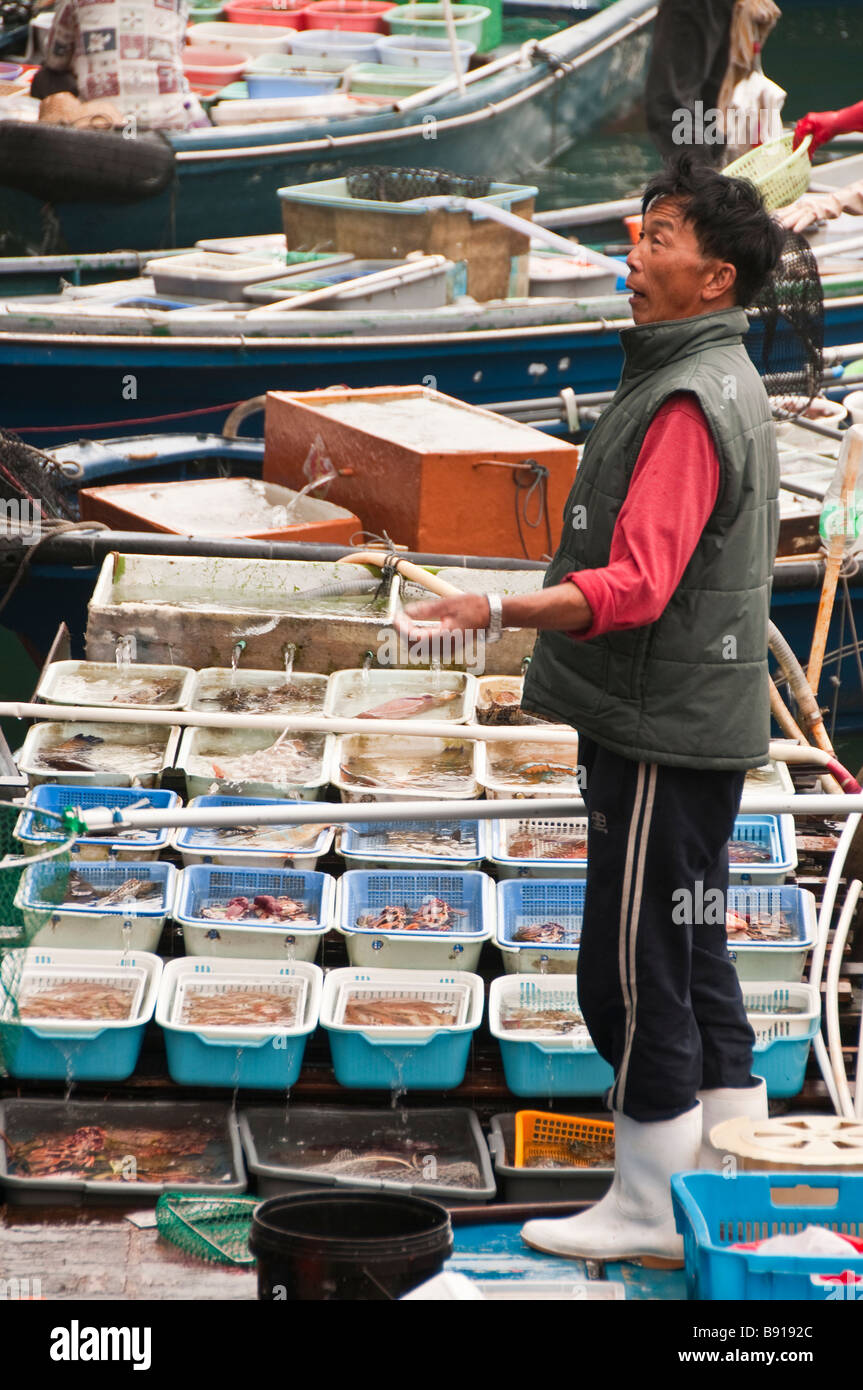 Fisherman selling the catch of the day Stock Photo - Alamy