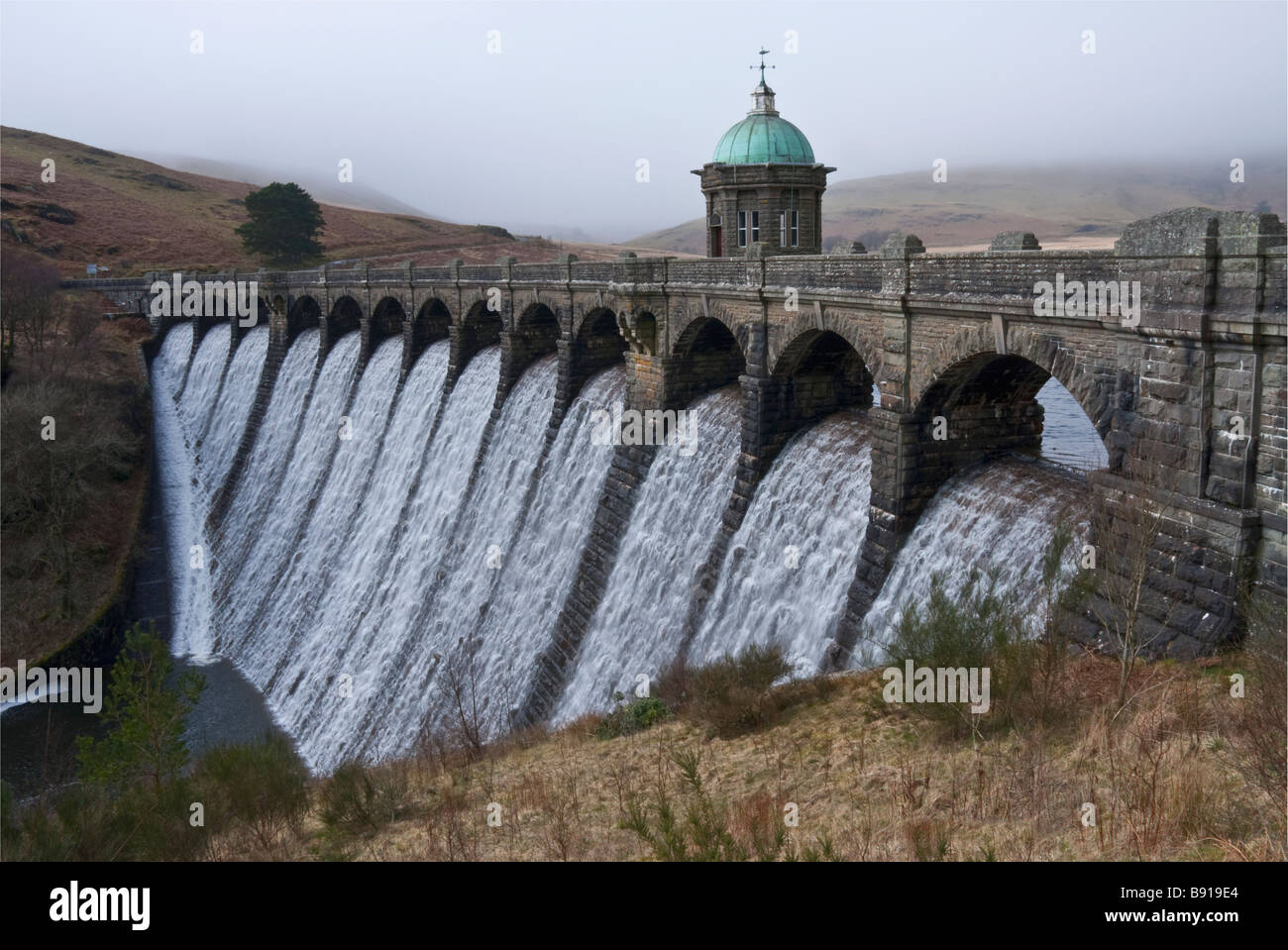 water overflowing the "craig goch" dam in the "elan valley Stock Photo ...
