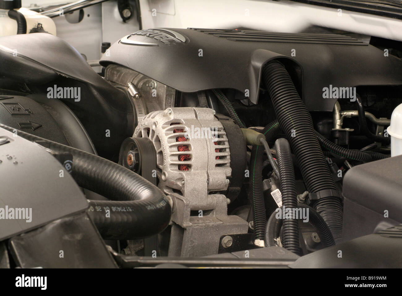 Alternator mounted on a new automobile engine Stock Photo - Alamy