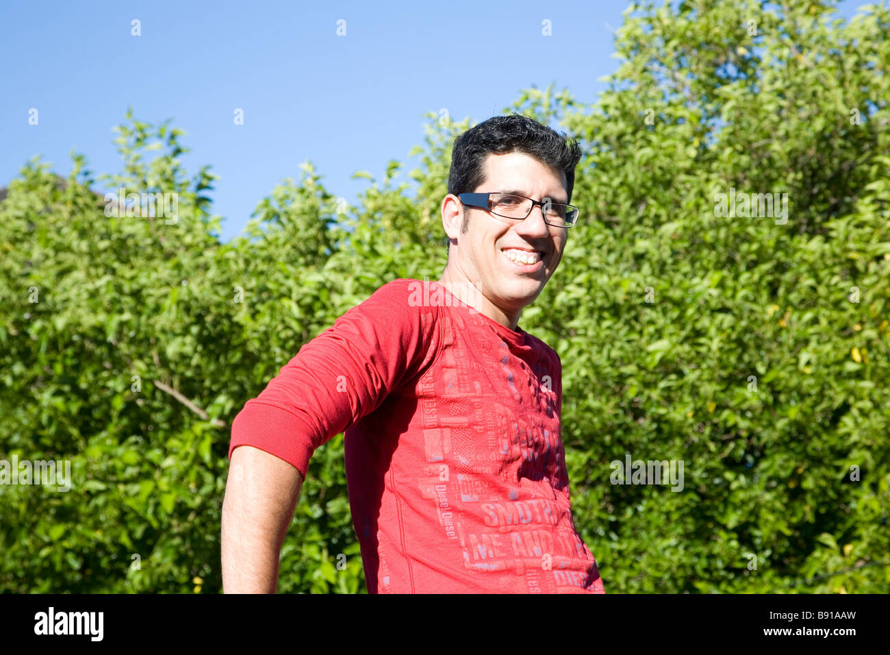 Dark man behind tree hi-res stock photography and images - Alamy