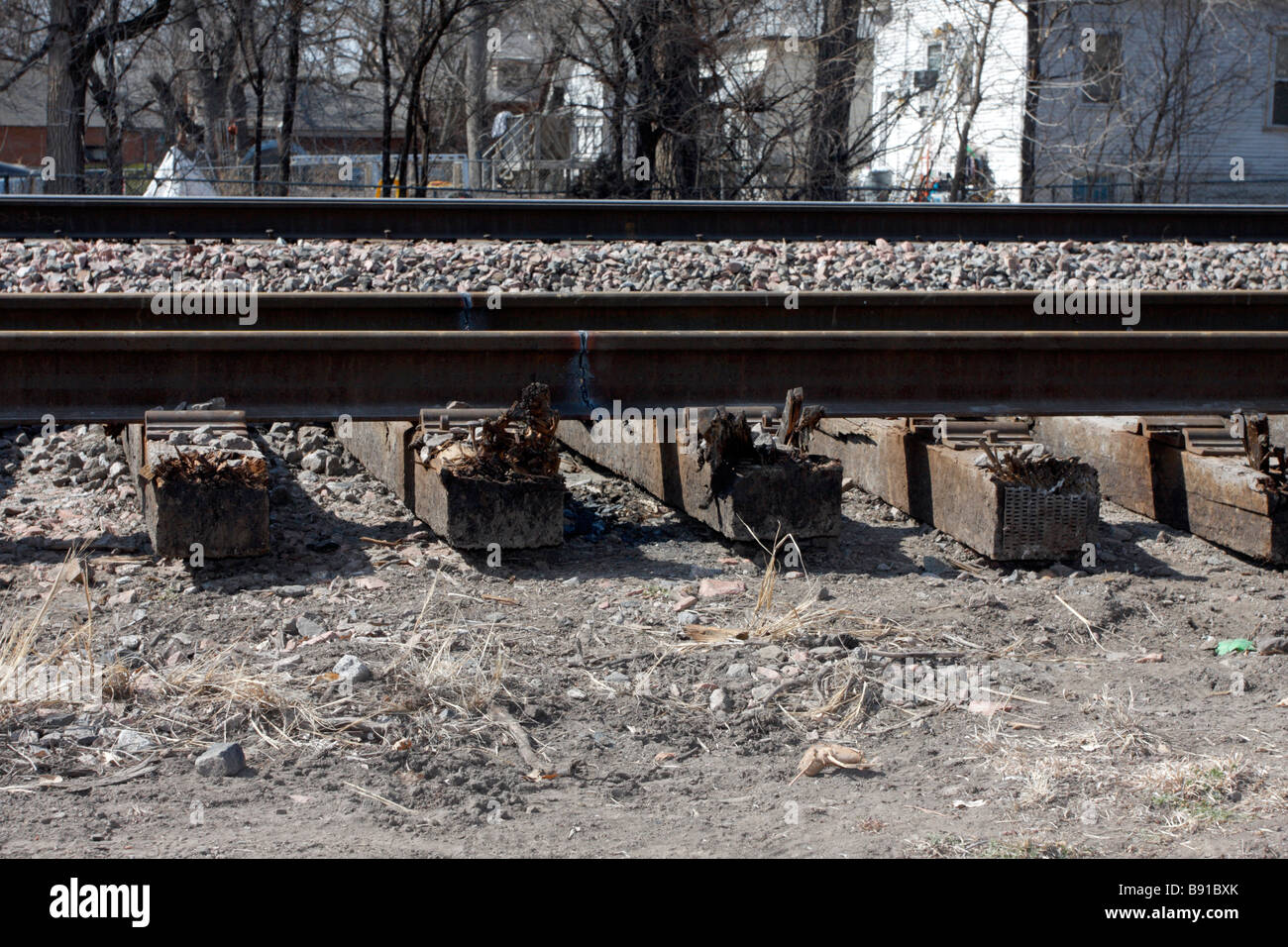 Used, excavated, discarded railroad track with ties attached next to ...