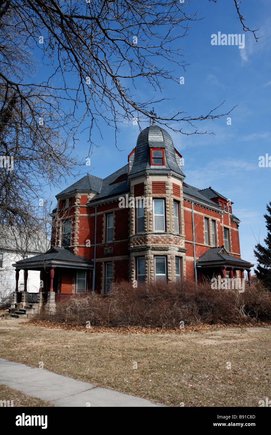 Historic brick house with slate roof and turret on corner, ca. 1890s ...