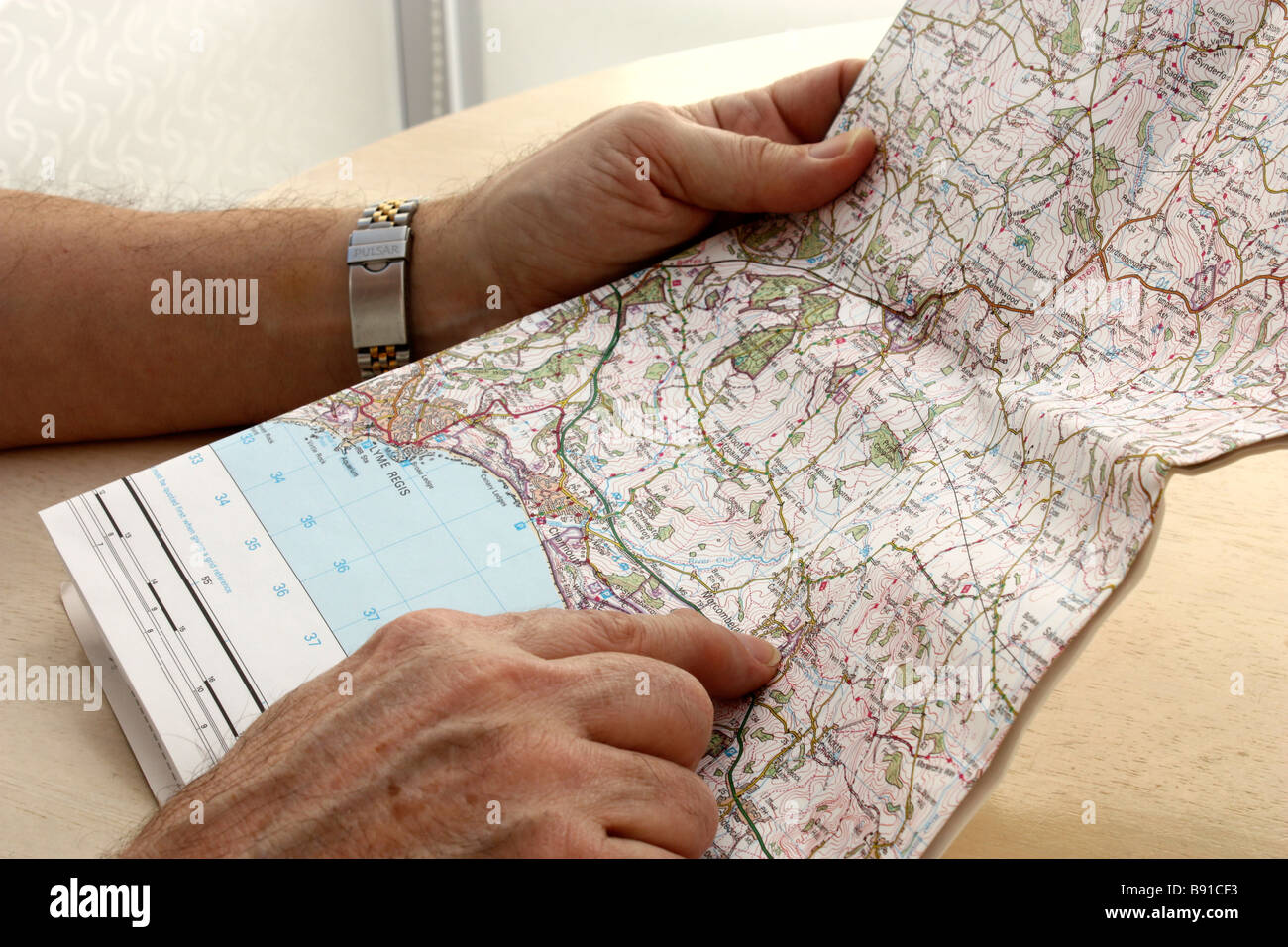 Man Looking at a Map Stock Photo - Alamy