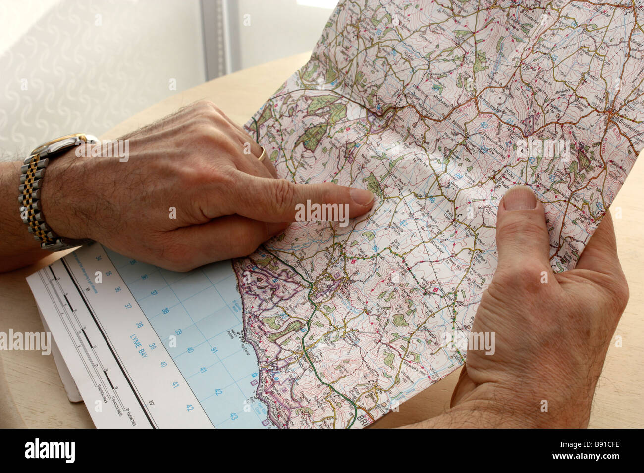Man Looking at a Map Stock Photo - Alamy