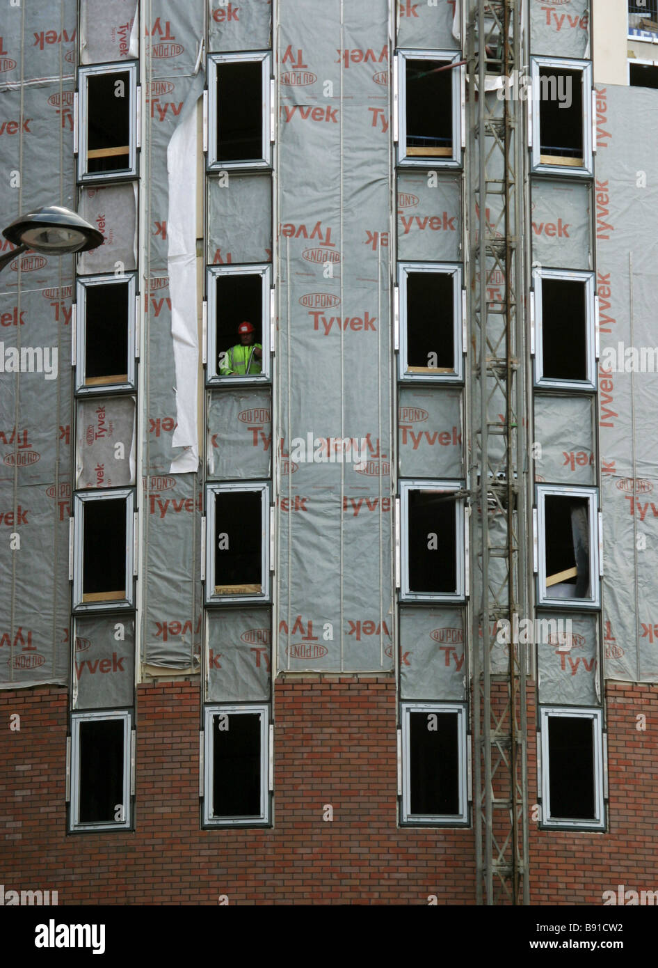 close up of windows on a high rise construction project Stock Photo - Alamy