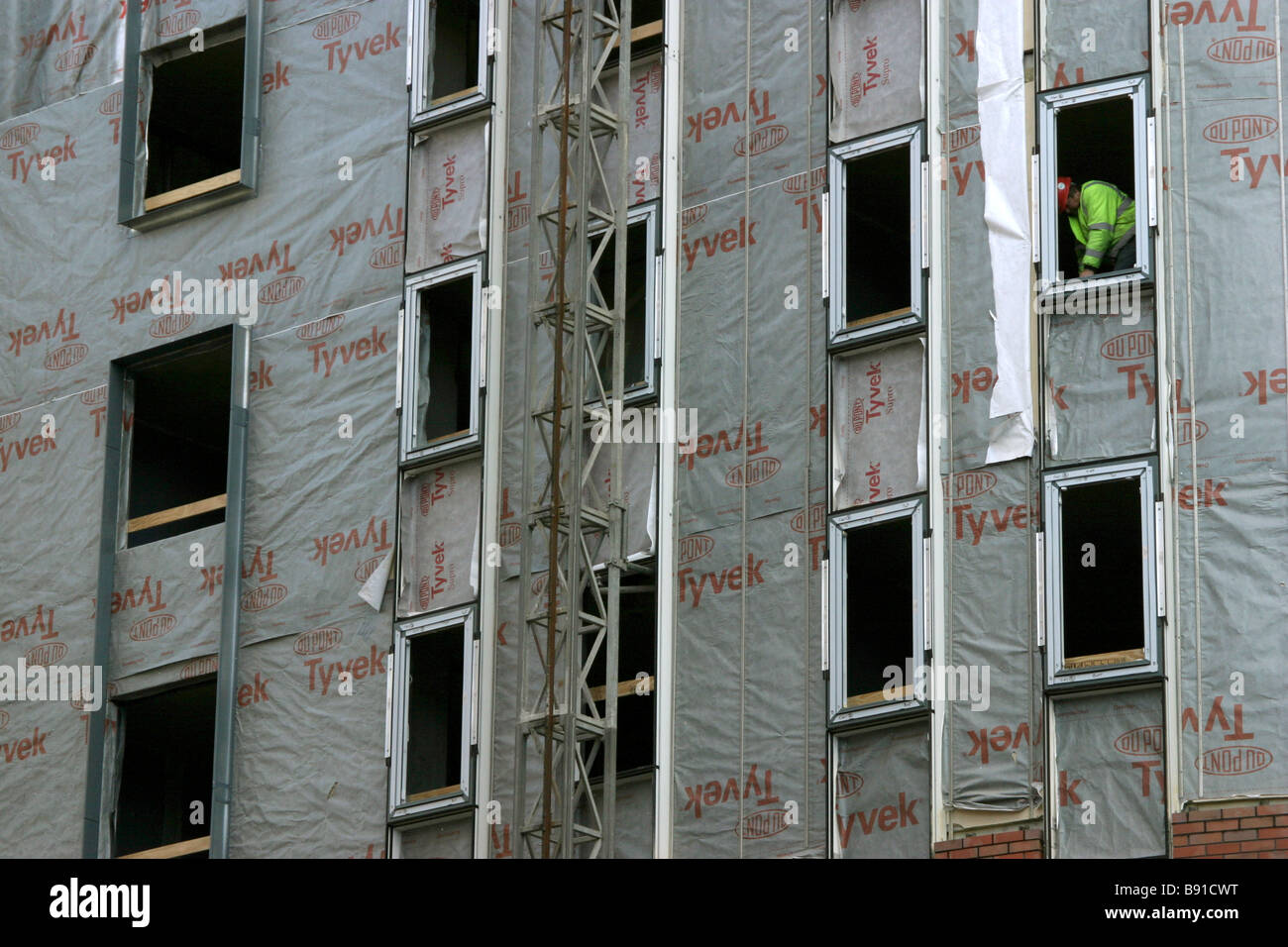 close up of windows on a high rise construction project Stock Photo - Alamy