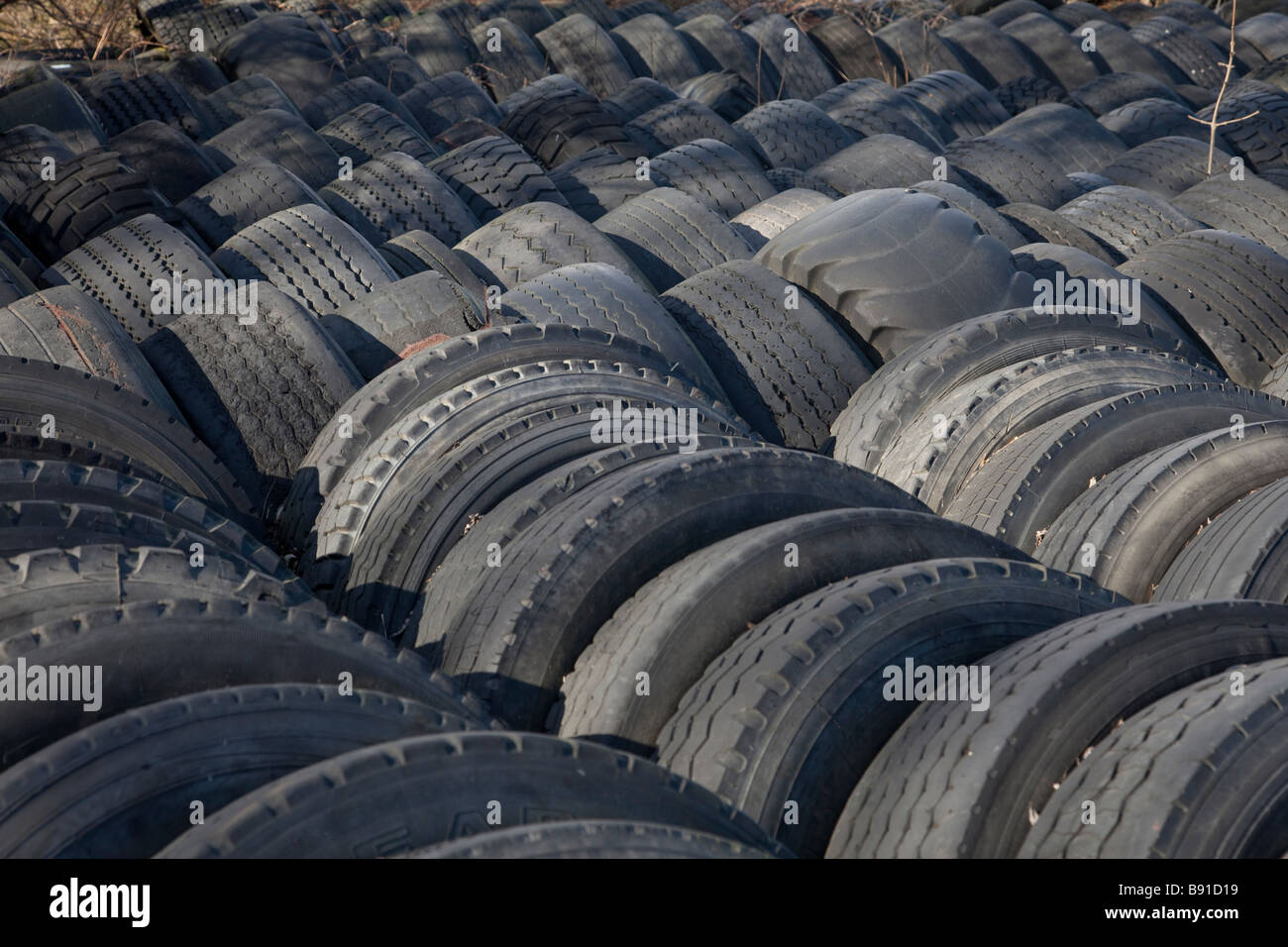 Old rubber tyres laid out Stock Photo - Alamy