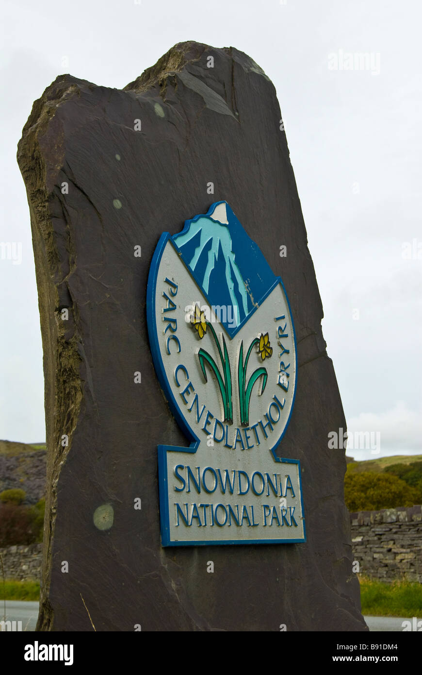 A sign for Snowdonia National Park mounted on to rock Stock Photo - Alamy