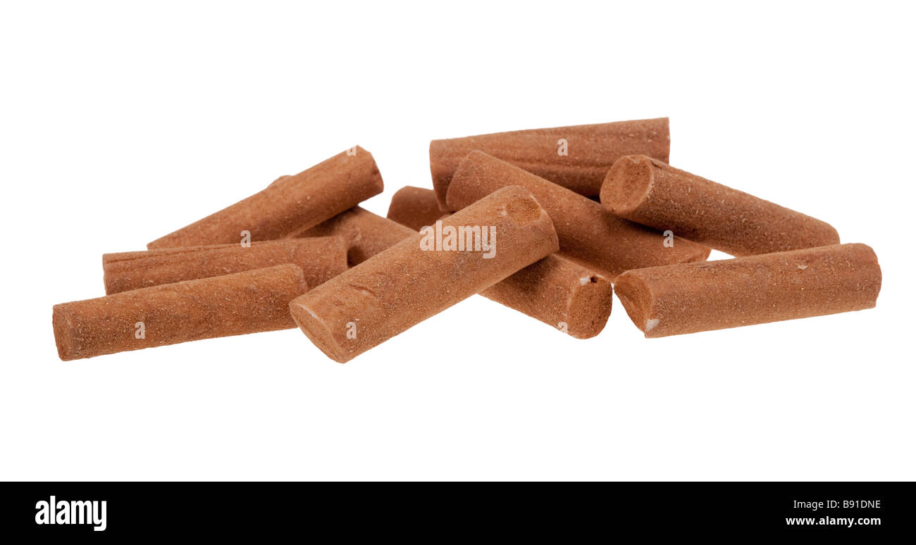 Cinnamon candy sticks isolated on a white background Stock Photo - Alamy