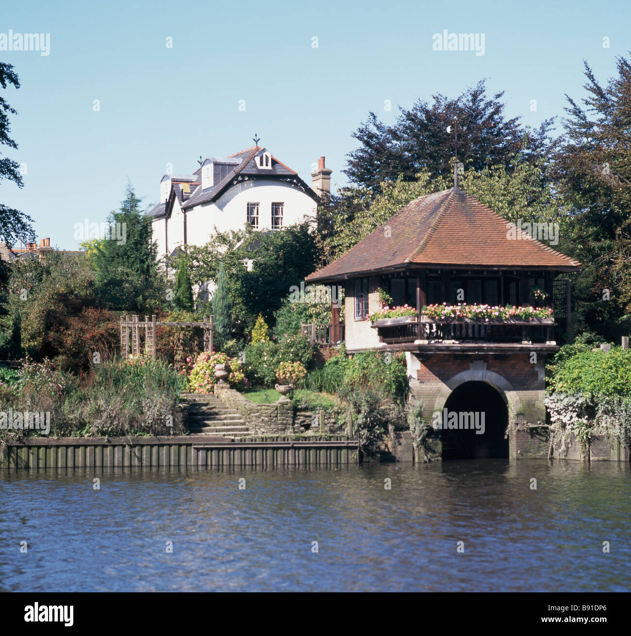 River Thames at Teddington Middlesex, riverside house with boathouse ...