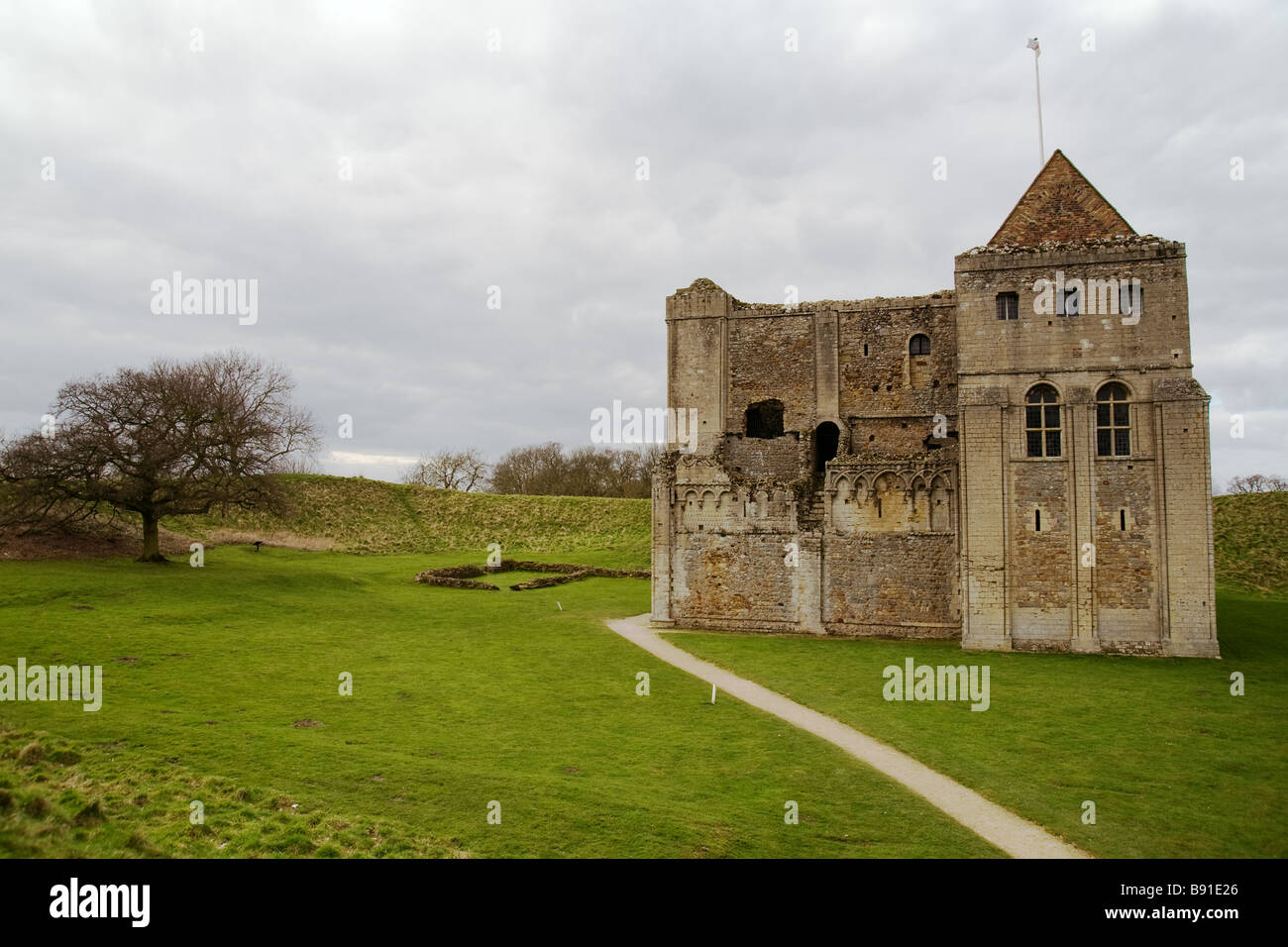 Castle Rising on left of tree Stock Photo - Alamy