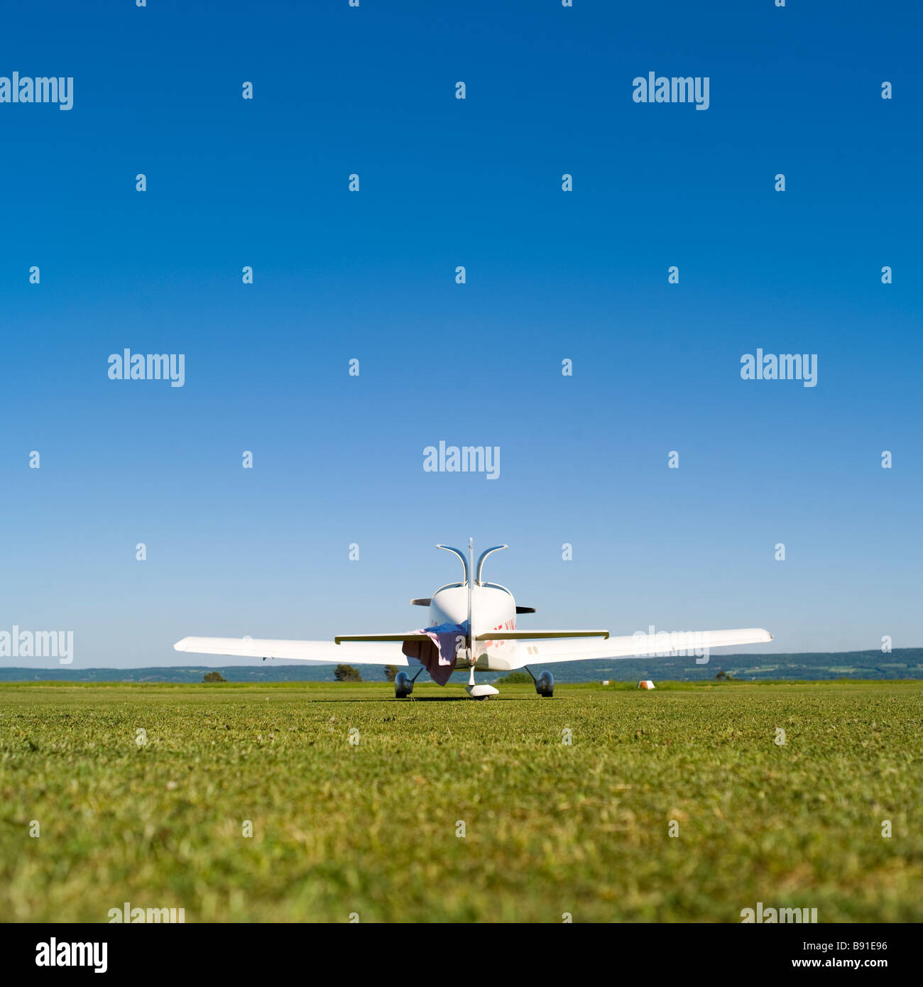 Small aeroplane on grass field Stock Photo - Alamy