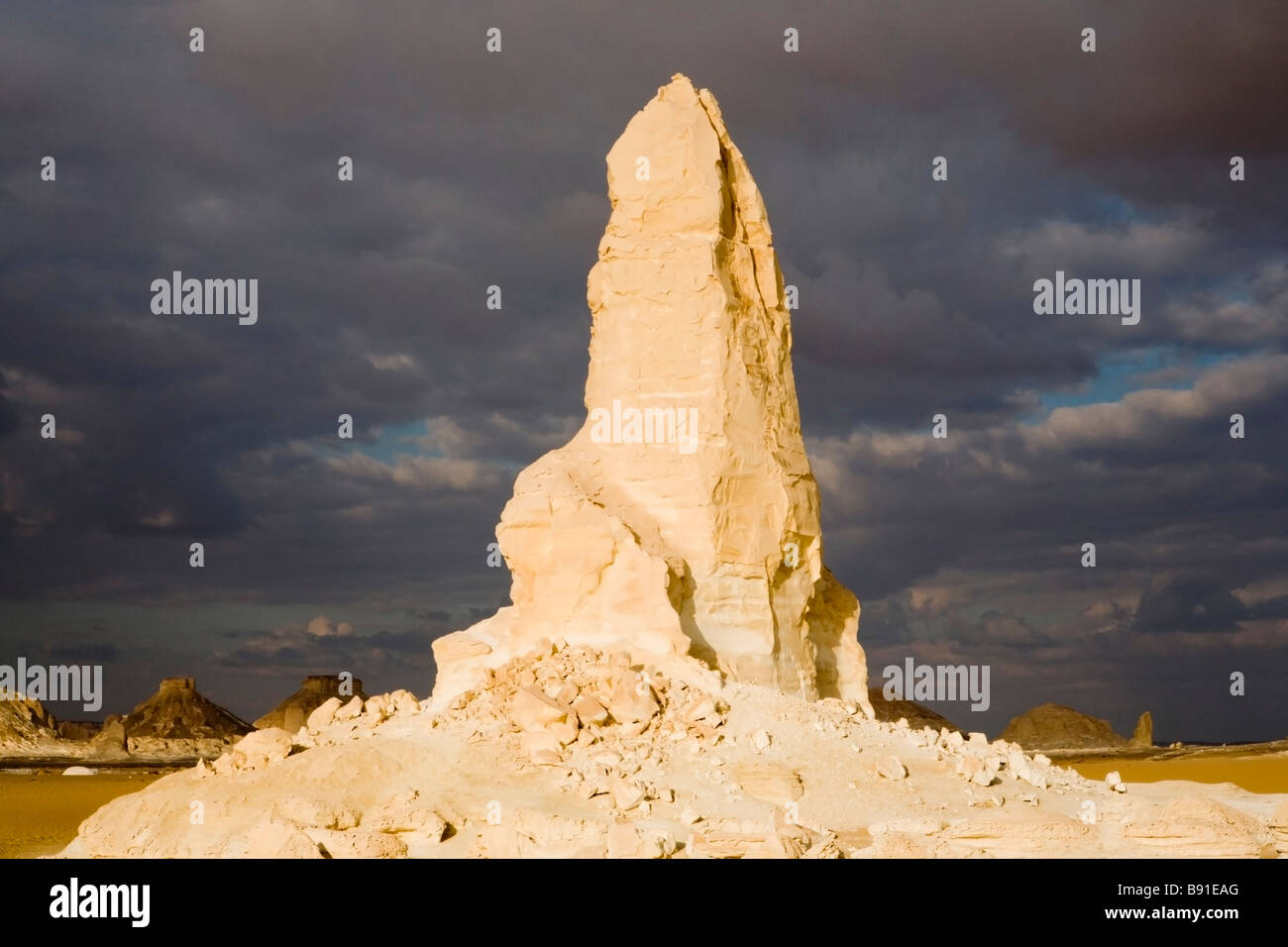 Inselberg in the White Desert, with dark stormy skies approaching, near ...