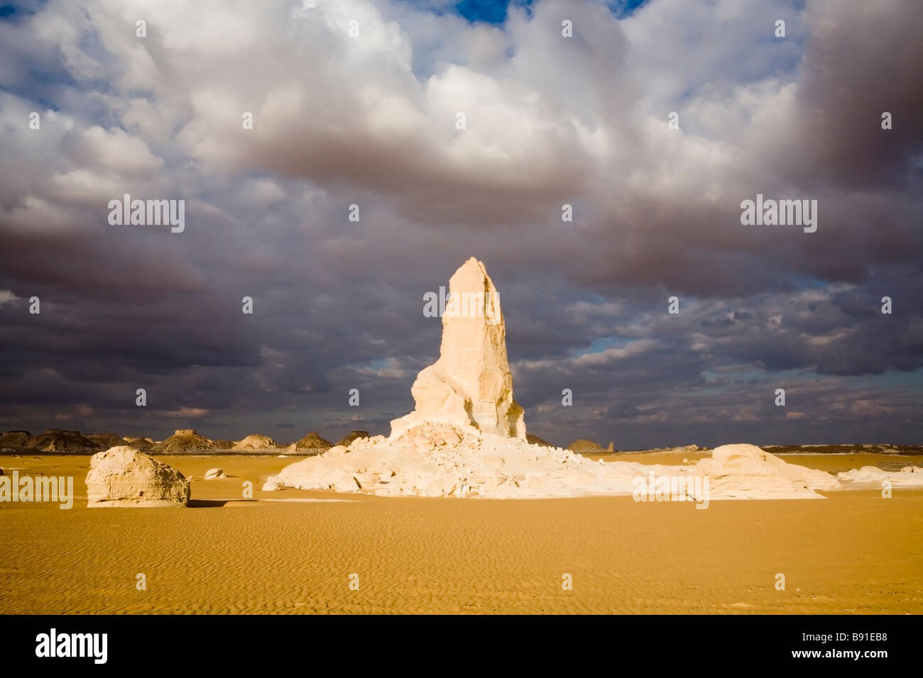 Inselbergs in the White Desert, with dark stormy skies approaching ...