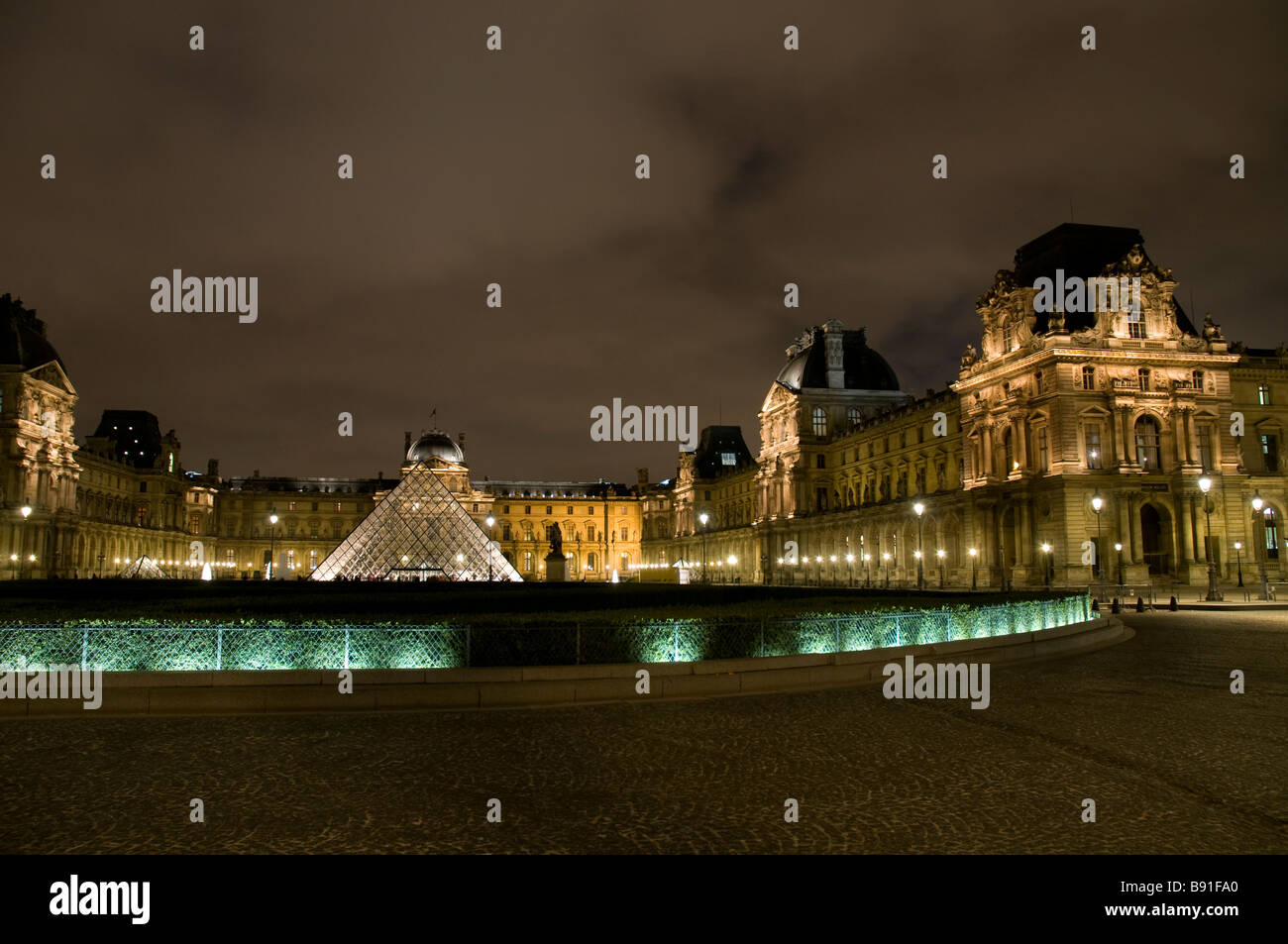 The Louvre Museum at night Stock Photo - Alamy