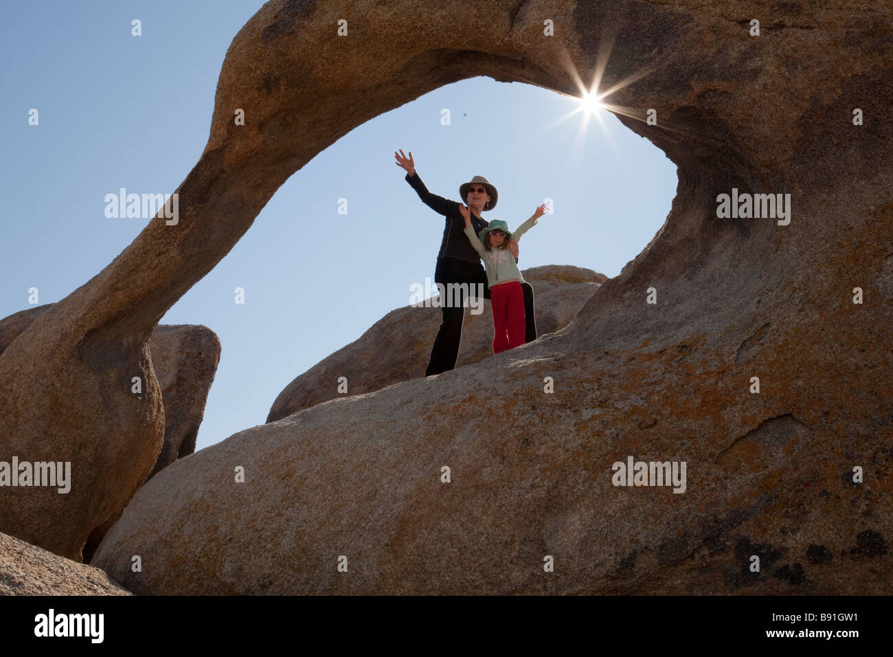 People in natural arch Stock Photo - Alamy