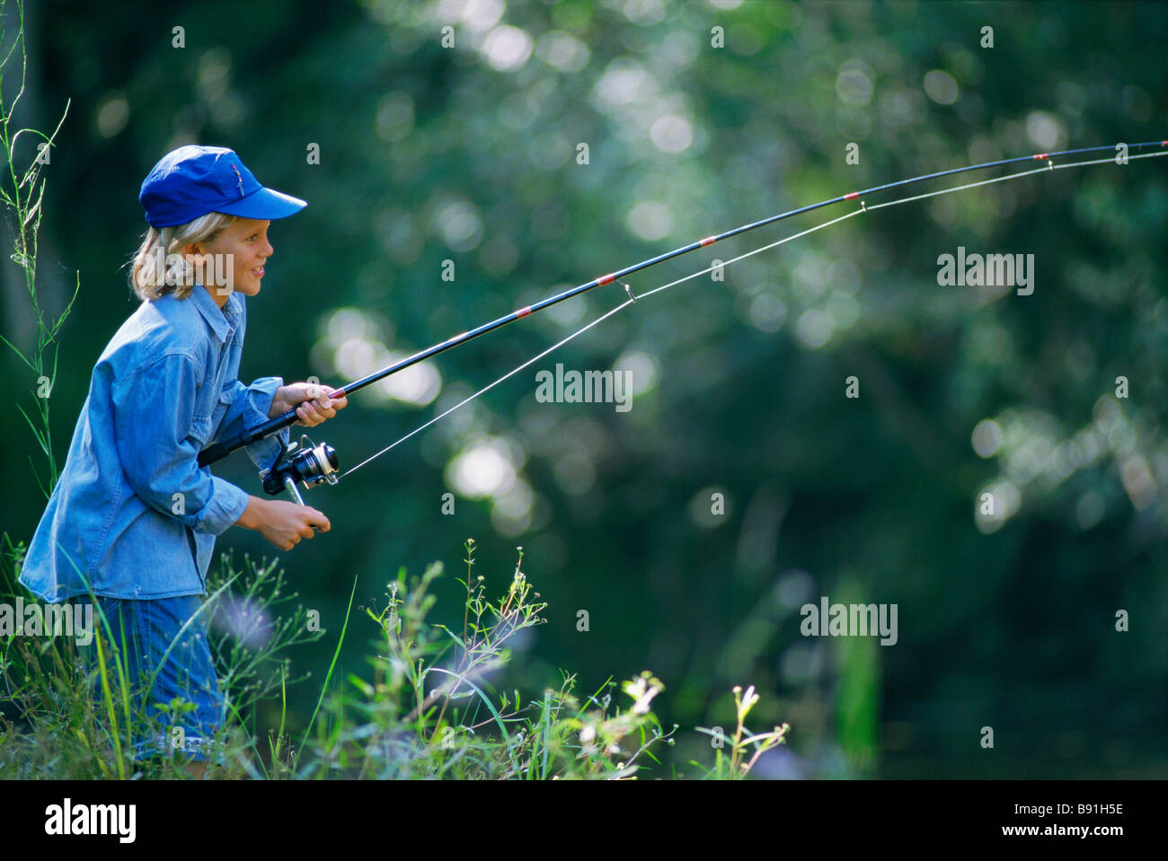 Child at fishing camp hi-res stock photography and images - Alamy