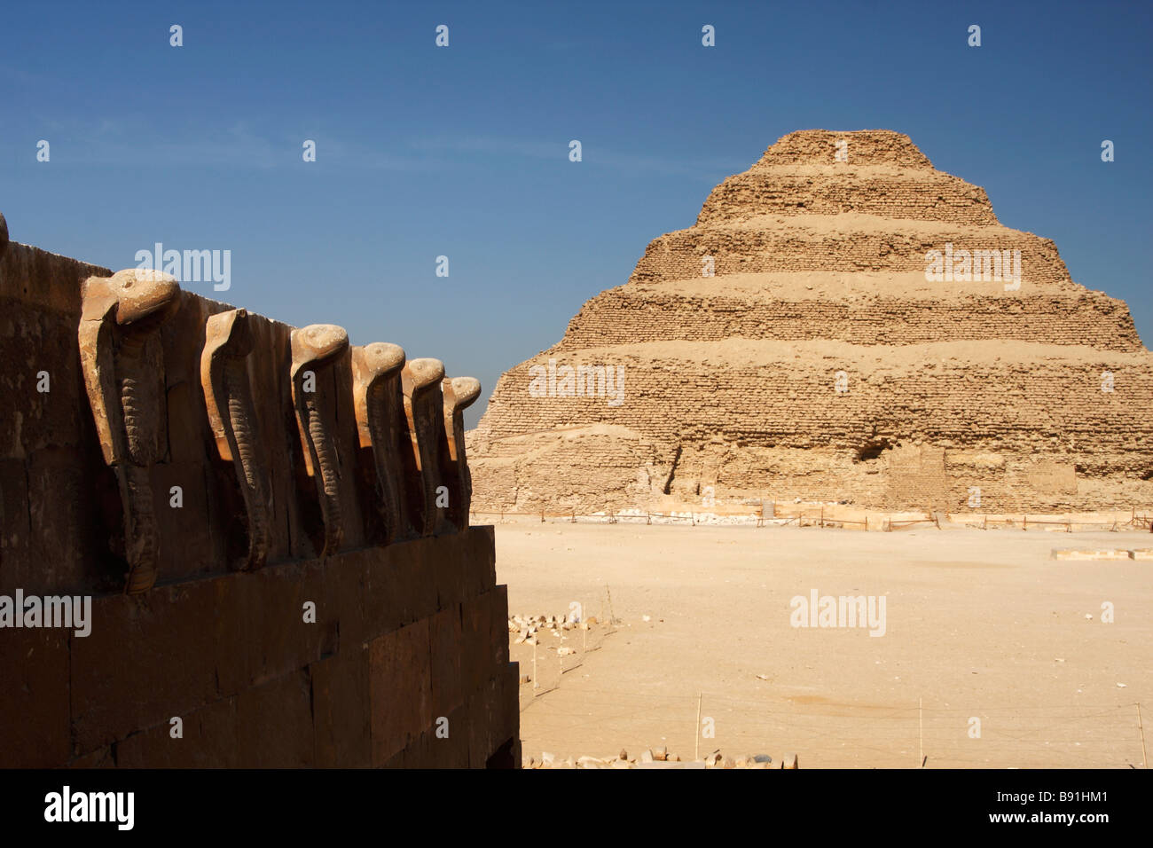[Step Pyramid] and cobra frieze on South Tomb Chapel, Funerary Complex of Djoser, Saqqara, Egypt ...