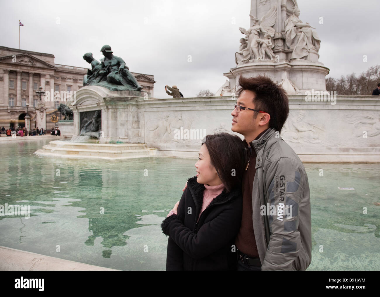 Asian oriental tourist couple in 20s / 30s visiting London, in front of ...