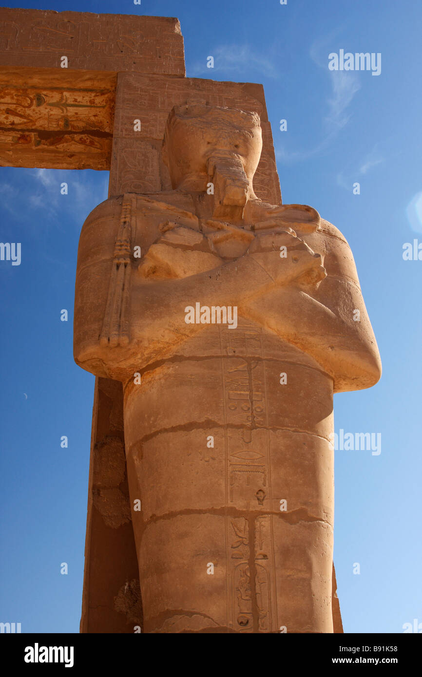 Osiris statue against blue sky, The Ramesseum [mortuary temple] of ...